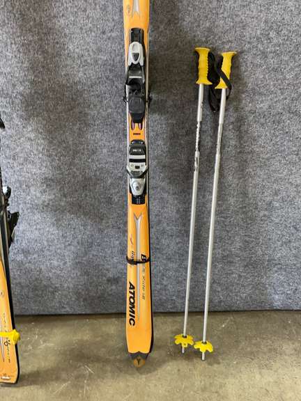 2 Pairs of Atomic Beta Ride Skis with Poles - 777 Auction Company