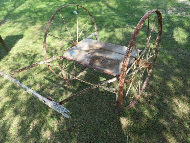 Antique milk cart with 46" steel wheels - AAA Auction and Realty