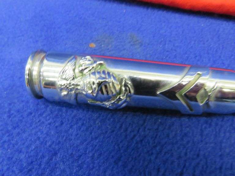 USMC decorative "bullet" with deployment stats - AAA Auction and Realty