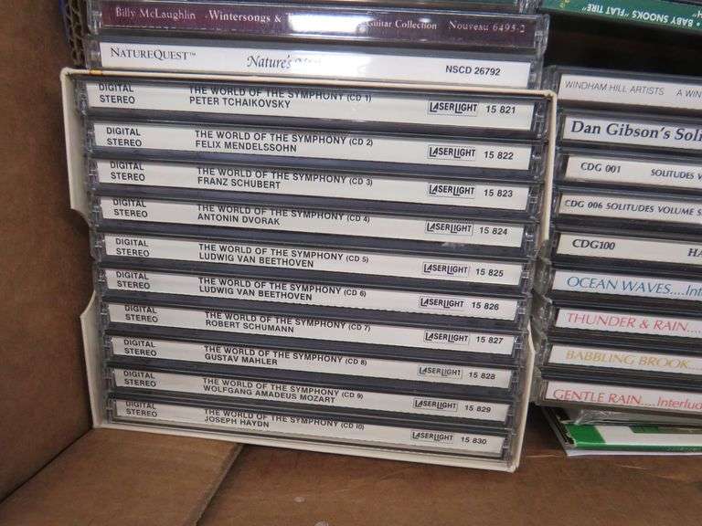 CDs and blank CD cases - AAA Auction and Realty