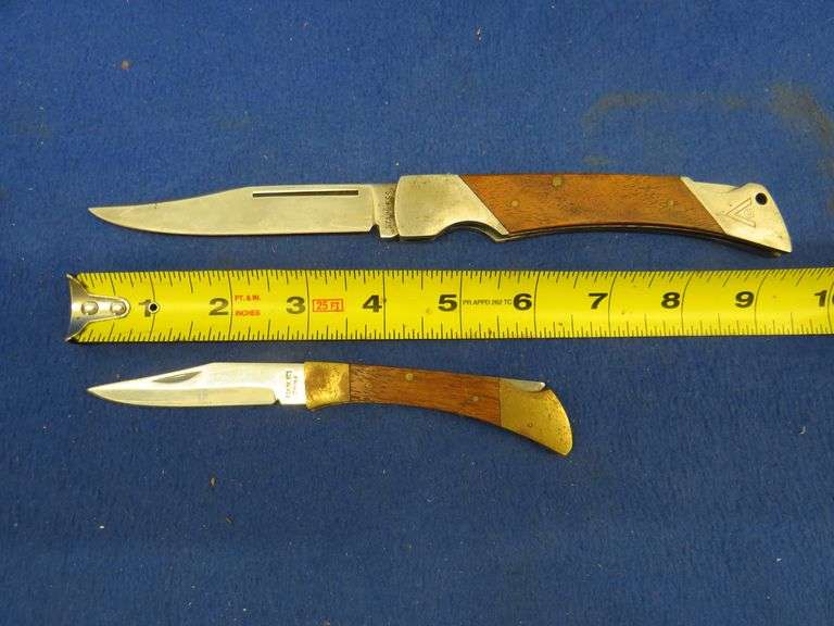 Two locking blade knives with wooden handles - AAA Auction and Realty