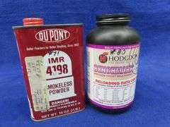 One-pound can of IMR 4198 smokeless powder and an open can of Hogdon ...