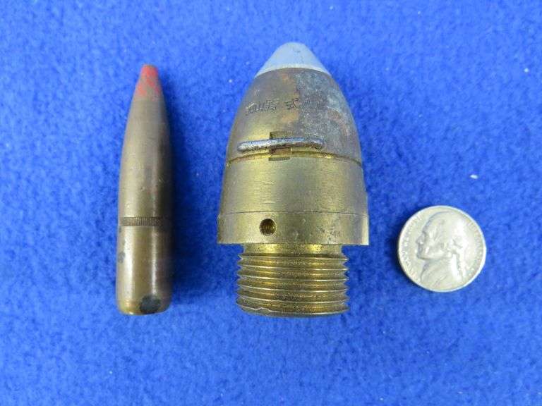 Business ends of a 50 caliber tracer and a Japanese 20mm shell - AAA ...