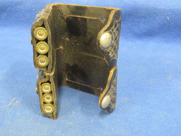 Leather belt case that holds six .410 gauge shotgun shells. Six shells ...