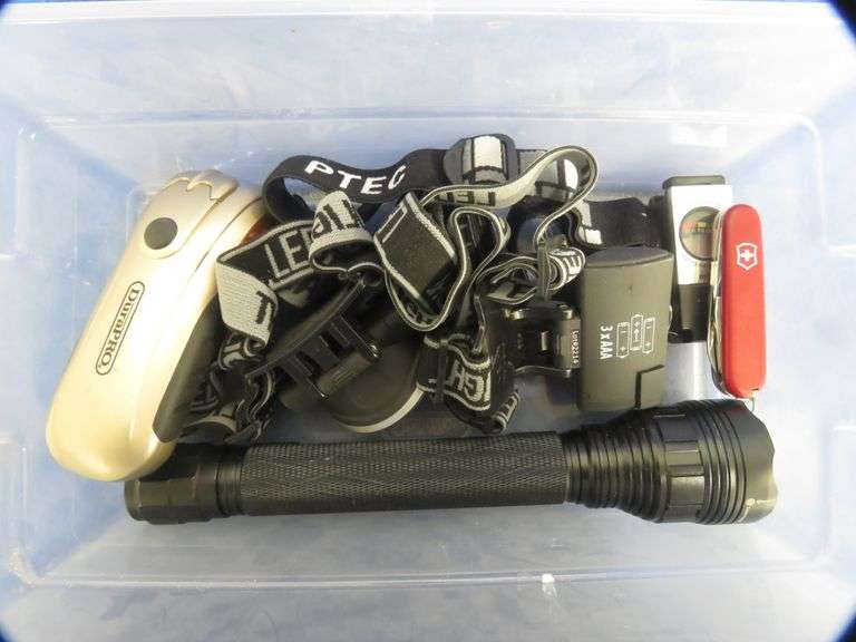 Three head flashlights, a Duracell flashlight, a hand crank light, a ...