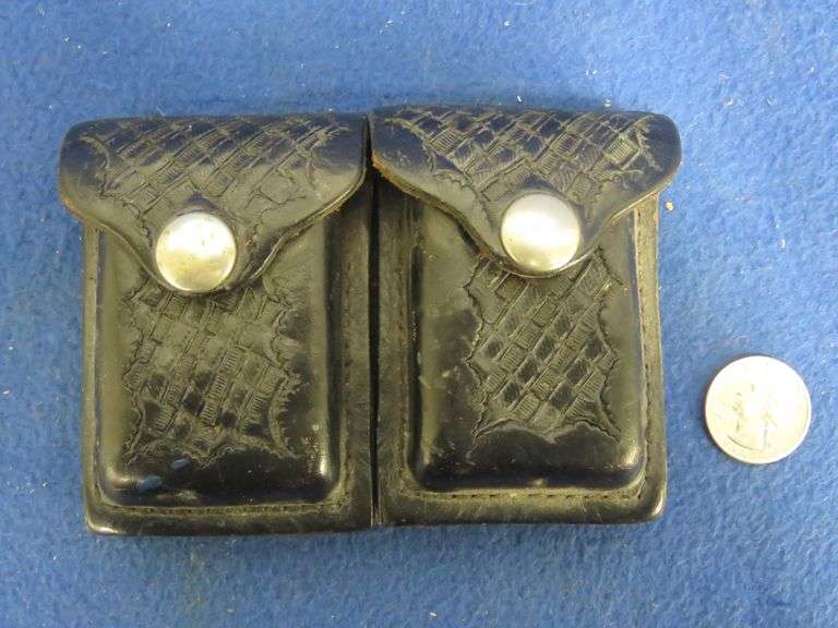 Leather belt case that holds six .410 gauge shotgun shells. Six shells ...