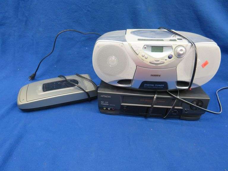 Phillips CD player, Hitachi VHS player, and a Dynex VHS rewinder. All ...
