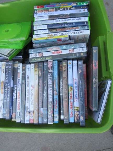 Sterilite 20-gallon tote with over 100 DVD's - AAA Auction and Realty