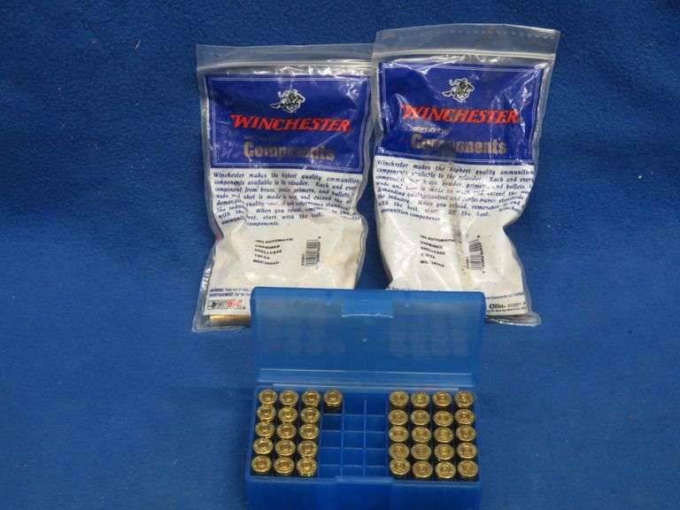 Two unopened bags of 100 ea. .380 Auto shell cassings, 16 empty and ...