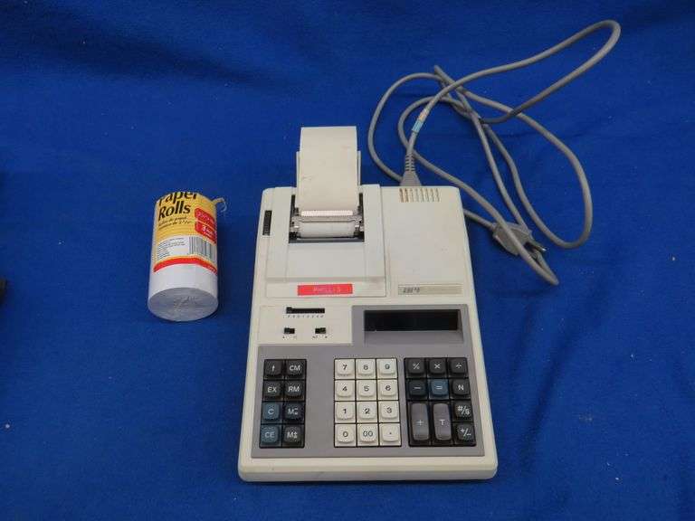 Working paper tape adding machine with extra tape - AAA Auction and Realty