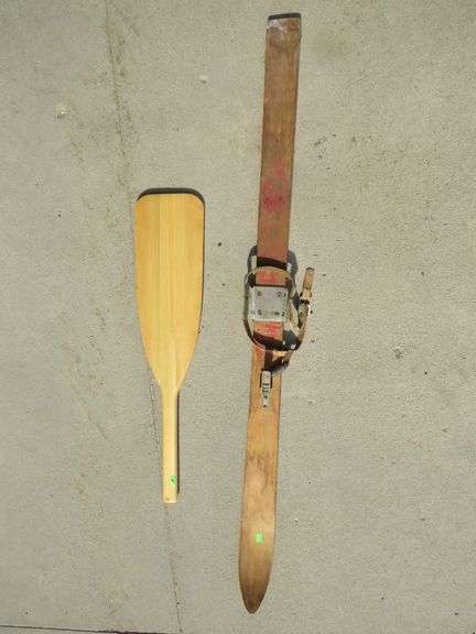 Long-handled tools and a short-handled paddle, plus one ski, and an ...