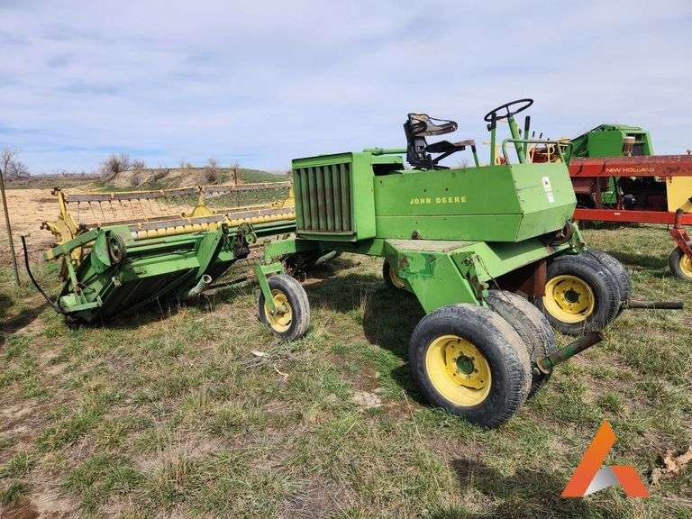 John Deere 800 Swather, 12' header - Ascent Auction