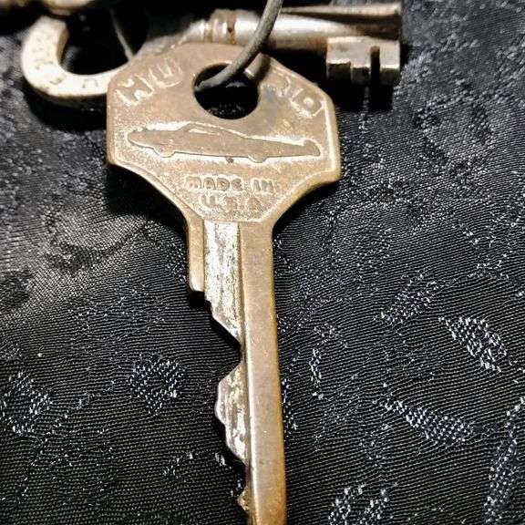 Ford Airplane key marked HURD on one side & Ford on the other; and ring ...