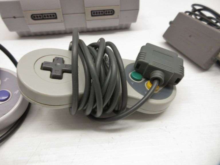 Super Nintendo with cords, controllers and (2) games, Super Mario World ...
