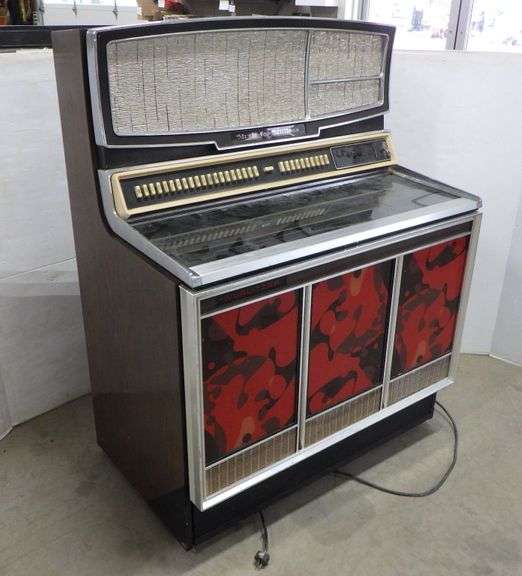 1970's Wurlitzer jukebox with keys, some 45's with it, 40"W x 51"H, has ...