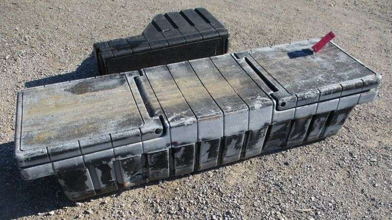 (2) Plastic truck tool boxes, one has several automotive hubcaps and ...