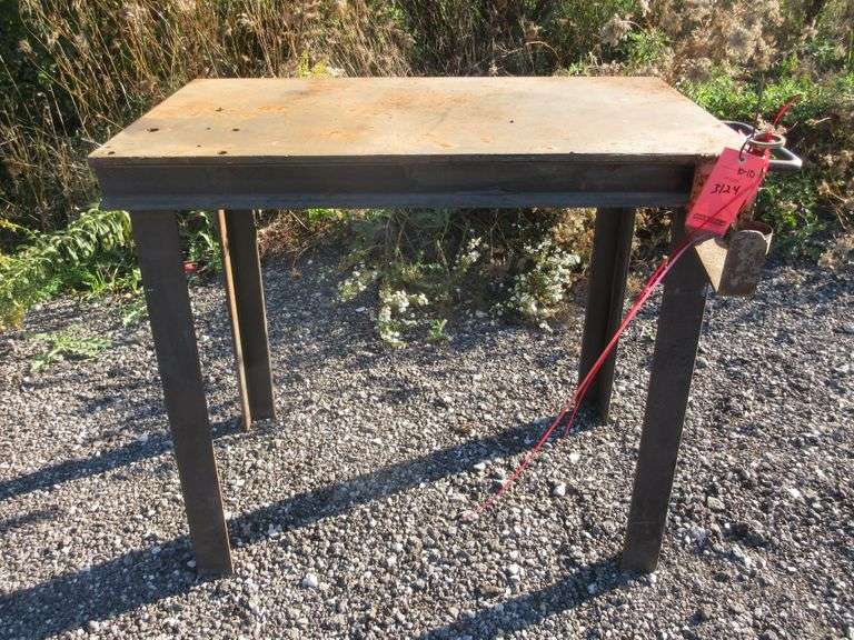Heavy steel table, one leg is a 1/2" shorter, 42"W x 26"D x 36"H, rough ...
