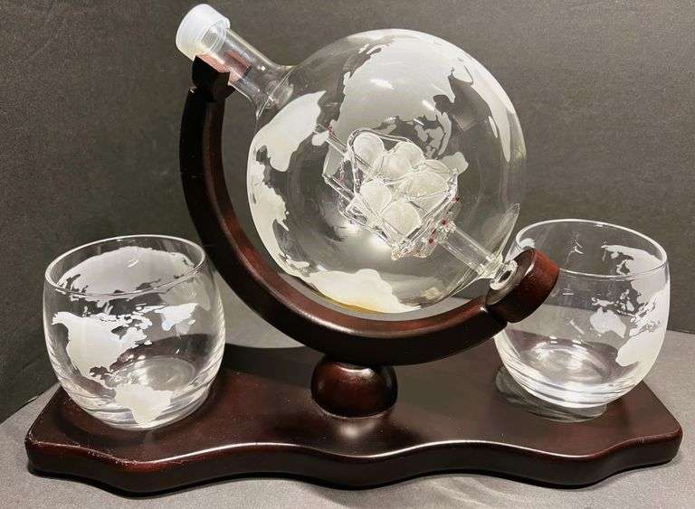 Blown glass ship on an earth globe glass decanter, and (2) matching ...