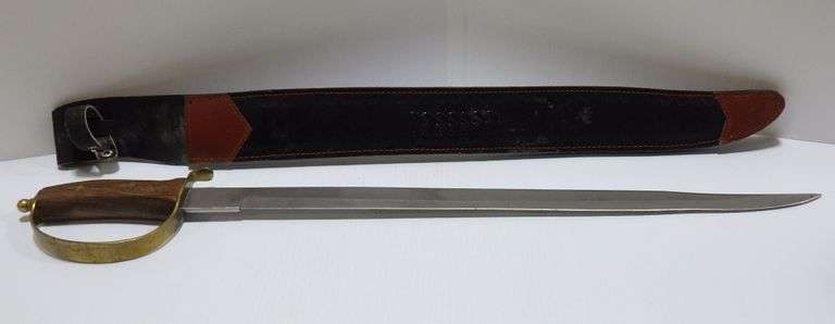 Sword with brass hand guard and leather sheath with belt loop, 28 ...