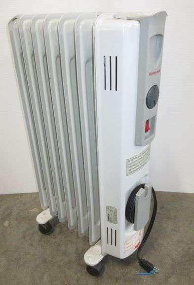 Honeywell electric radiator style space heater on wheels, 26"H, in good ...