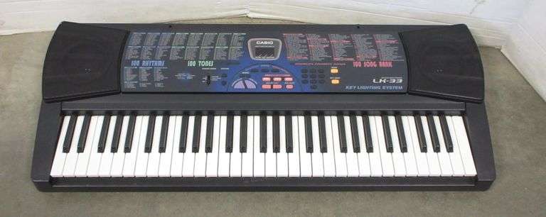 Casio keyboard, model LK-33, comes with a 100 songbank, keyboard lights ...