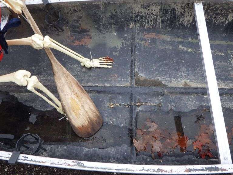 Halloween prop canoe with skeleton, not seaworthy - Albrecht Auction ...
