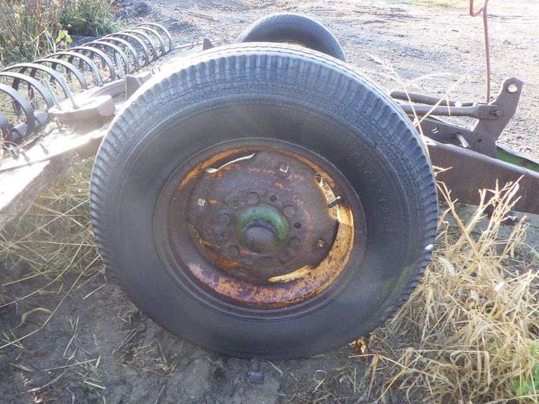 Spring tooth drag harrow with 15" tires, harrow pivots down from frame ...