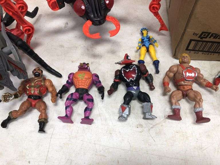 (40) He-Man action figures, (5) Vehicles, (35) Mini comics, and ...