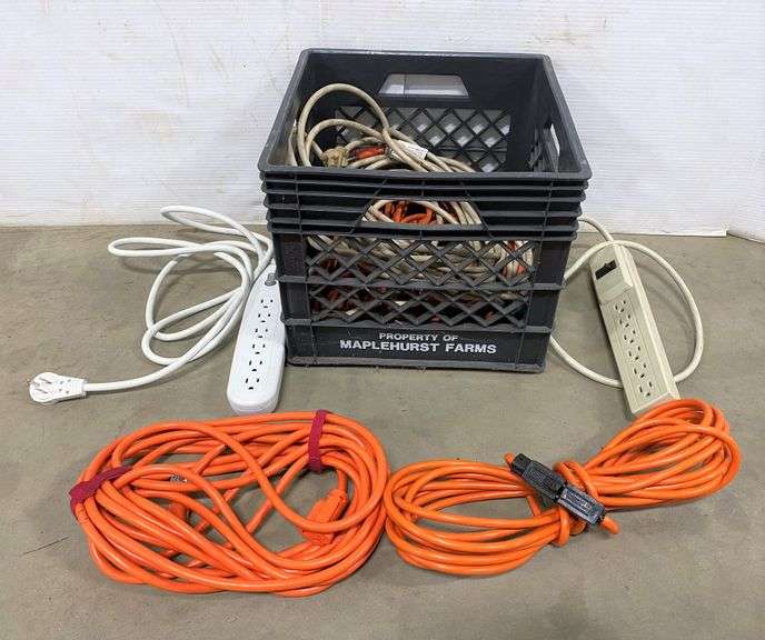 Milk crate with (5) extension cords, various lengths; (2) Power strips ...