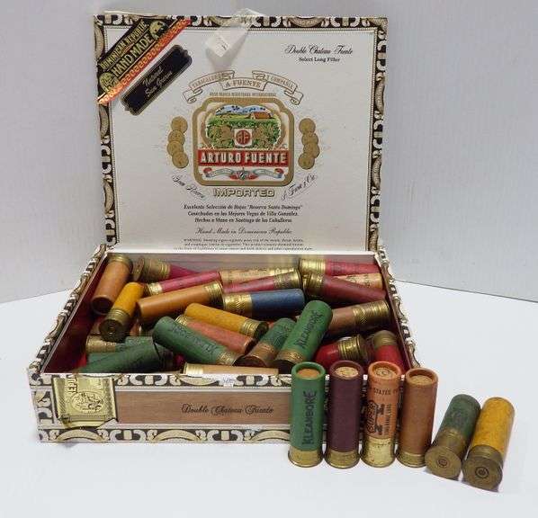 Cigar box filled with older shotgun shells, various gauges and shots ...
