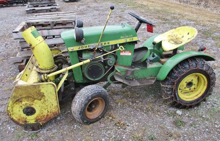 John Deere 112 lawn tractor with hydraulic lift, includes snow blower and tire chains, runs, no ...