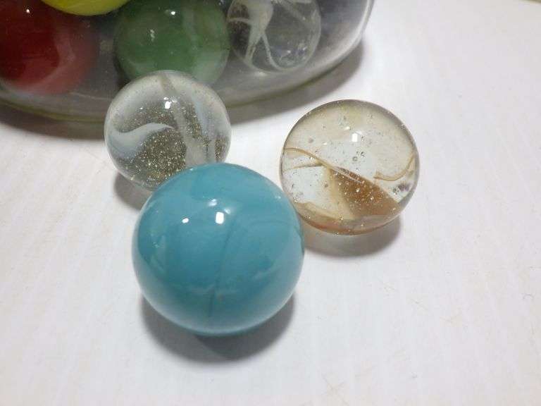 Over (100) Marbles in a half-gallon jar - Albrecht Auction Service