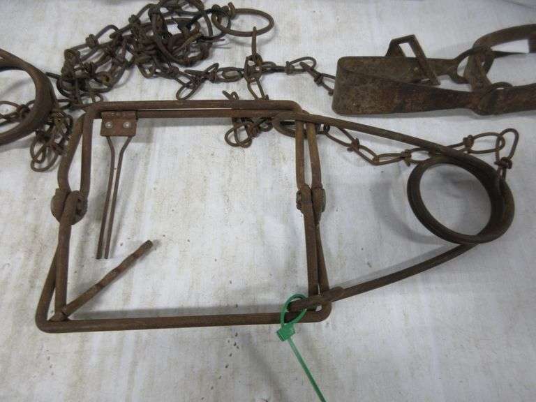 (2) Conibear traps, and (2) jaw traps - Albrecht Auction Service