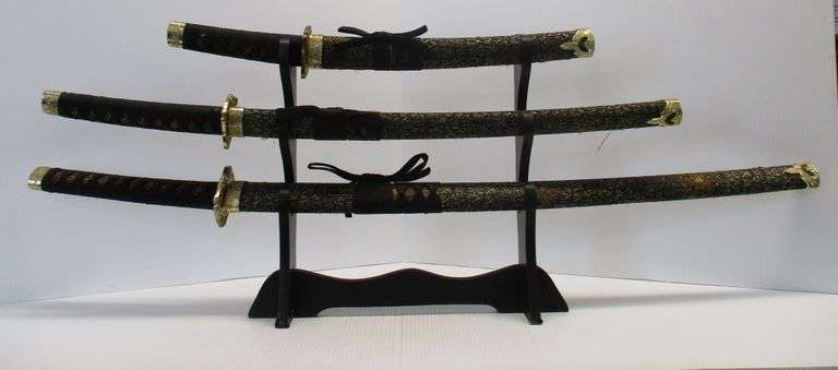 Set of (3) Japanese samurai swords with tiered display stand, up to 37 ...