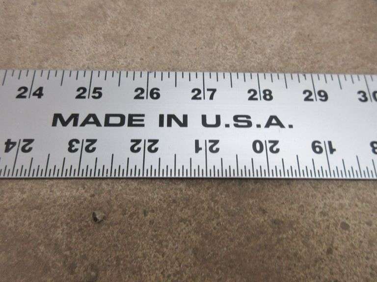 Johnson 4' aluminum ruler - Albrecht Auction Service