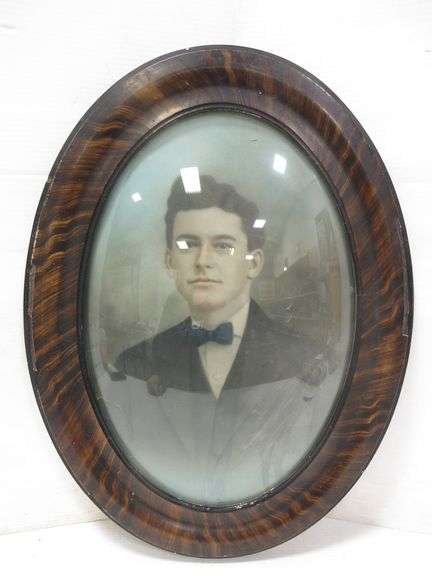 Antique oval shaped portrait with curved glass, 24 1/2" x 18 1/2", has ...