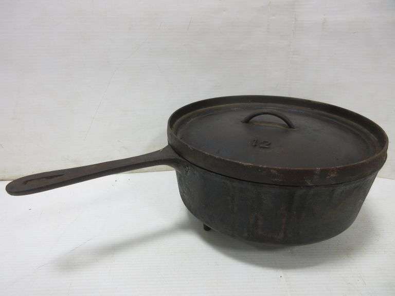Antique cast iron pot and lid with legs, 12"W - Albrecht Auction Service