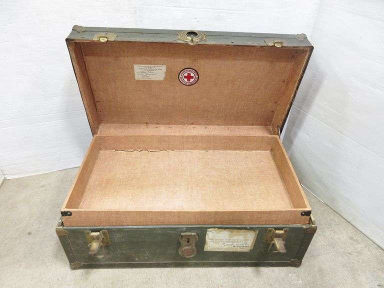 Old WWII era army green foot locker/trunk with red cross patch inside ...