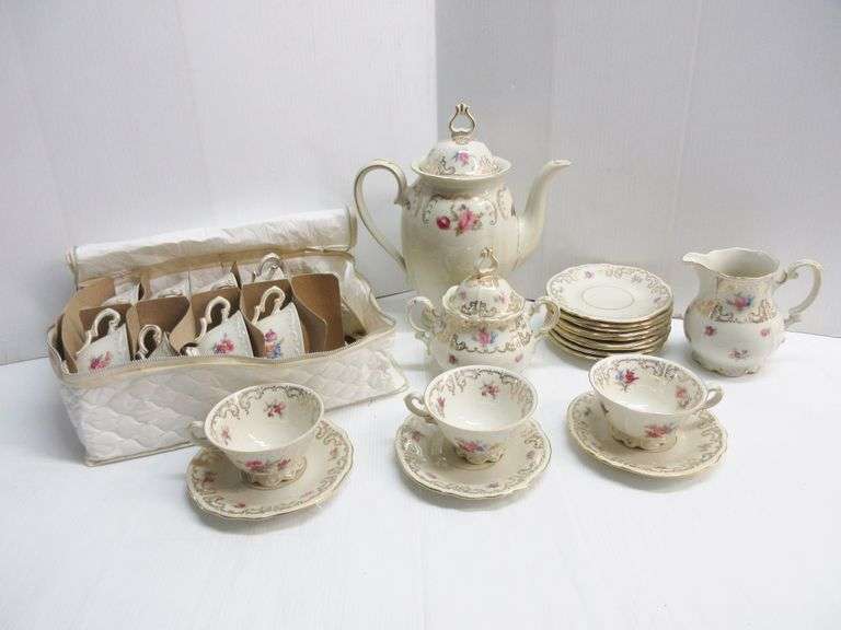 (12) WWII cups, (1) three-piece WWII tea set, and (12) WWII saucers ...