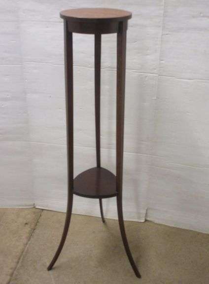 Two-Tier plant stand mahogany, three-legged, 9"W x 42"H, has finish ...