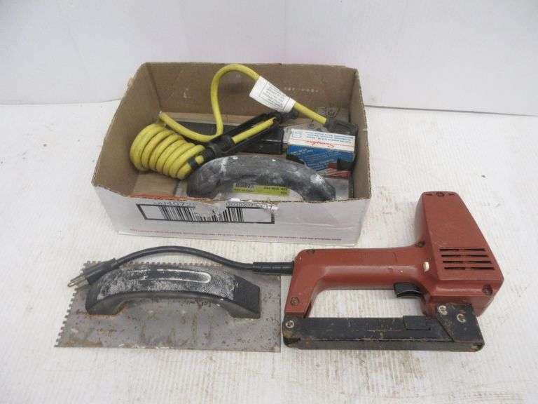 Various tools, include: Stapler, Slap stapler, (2) Trowels, and a short ...