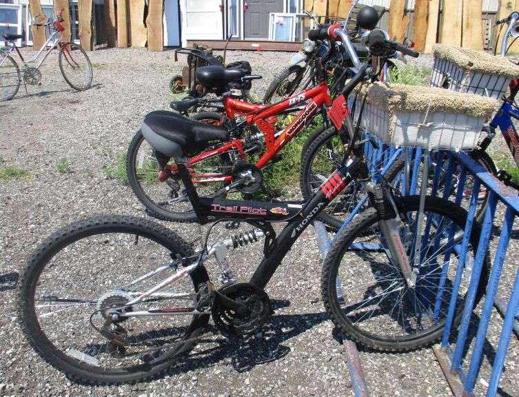 26" Mongoose Racing Trail Pilot, 21-Speed, black and red in color ...