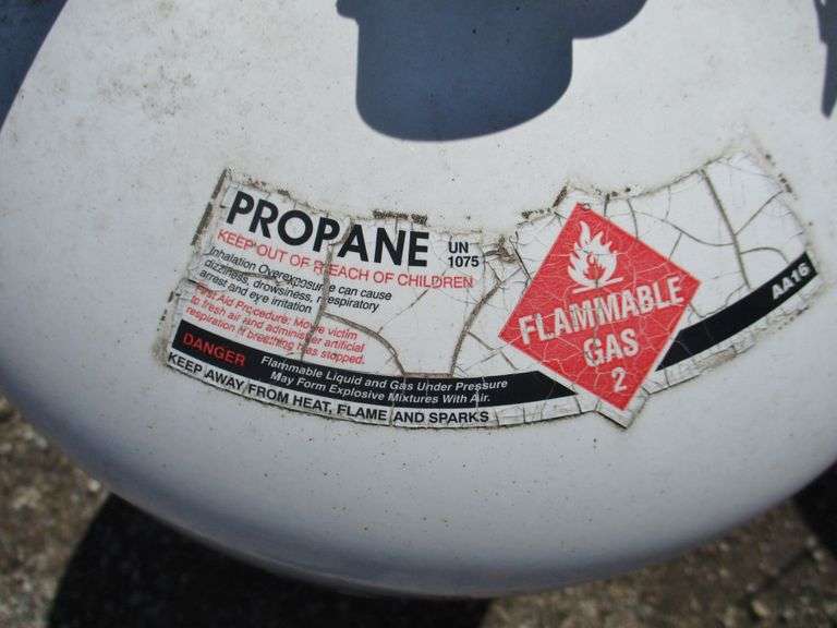Between half and empty 30lb. tank of propane - Albrecht Auction Service