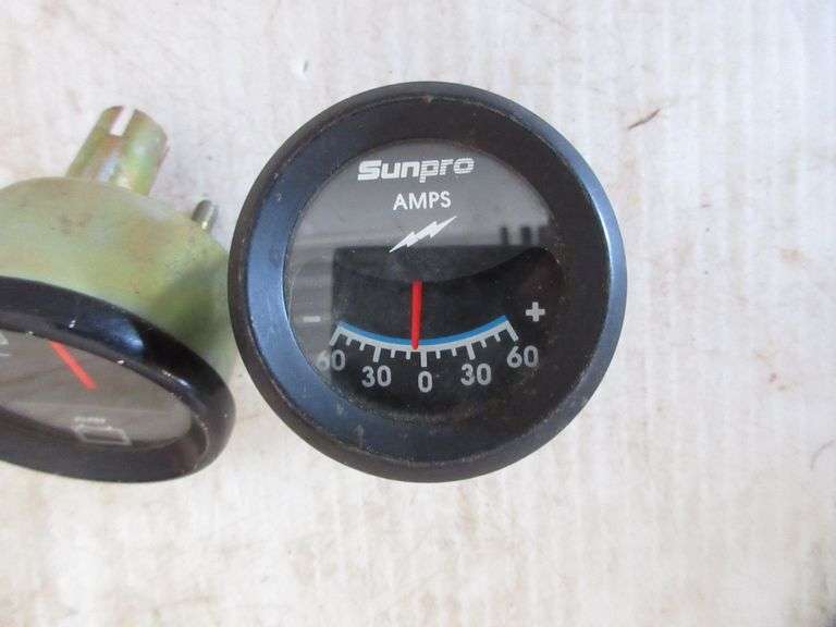 Sunpro automotive amps gauge, and an automotive voltage gauge, used ...