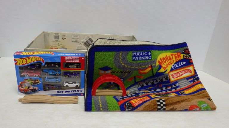 Brio wooden track sections, Hot Wheels play rug, and Hot Wheels cars ...