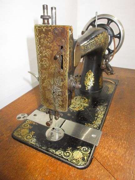 Antique cast iron singer sewing machine, some veneer chips on top, nice ...