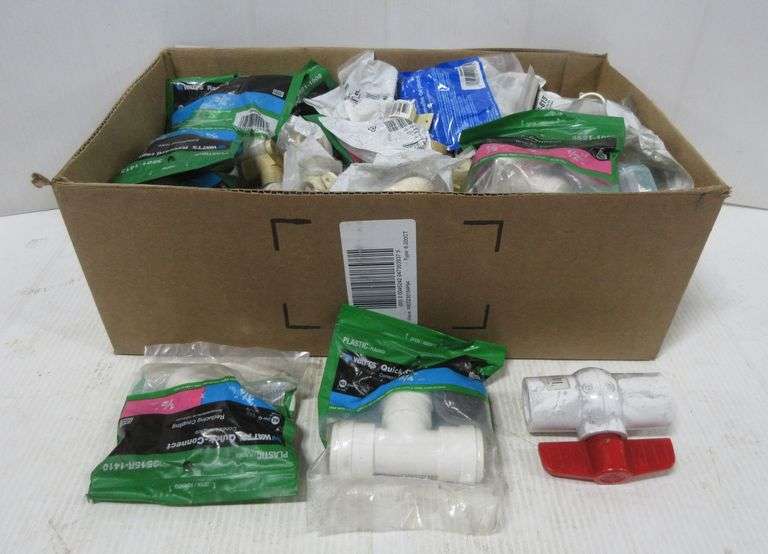 Box of various pipe fittings, including: PVC, CPVC, and Watts Quick ...