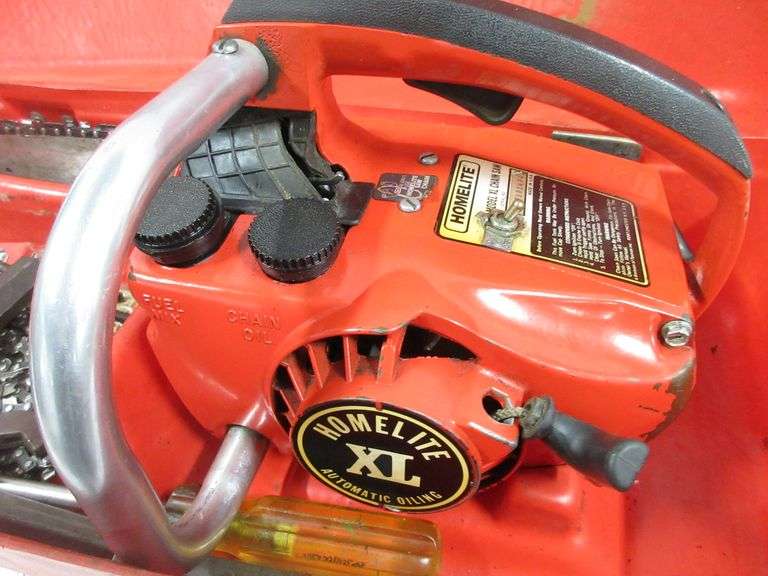 Homelite chainsaw with case and tools, includes two extra chains, 12 ...