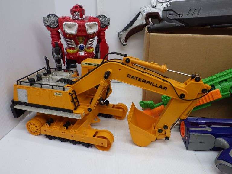 Toys guns, tractor, Transformer, and more, various sizes and conditions ...