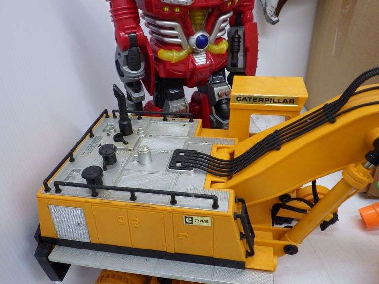 Toys guns, tractor, Transformer, and more, various sizes and conditions ...